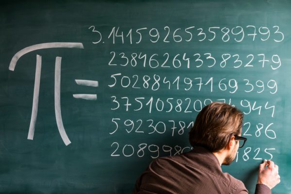 Teacher, student, scientist hand writing Pi numbers on green chalkboard ...